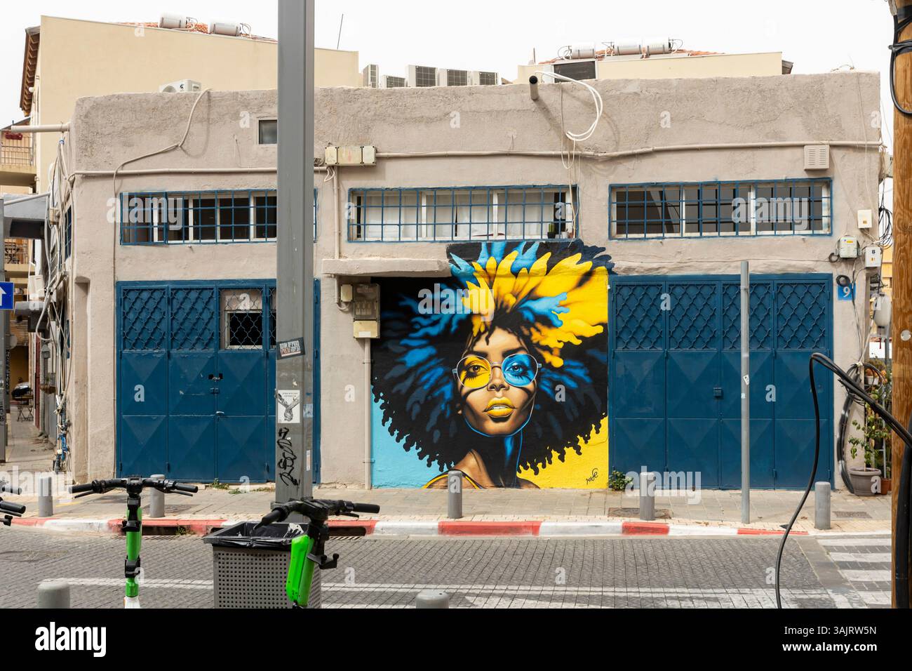 Tel Aviv, Israel, 10 April 2025, A vibrant street art mural of a woman ...