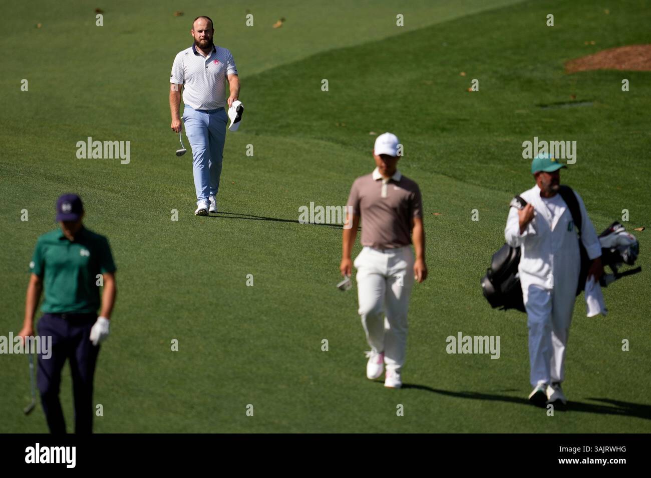 Tyrrell Hatton, of England, walks to the green on the 10th hole during ...