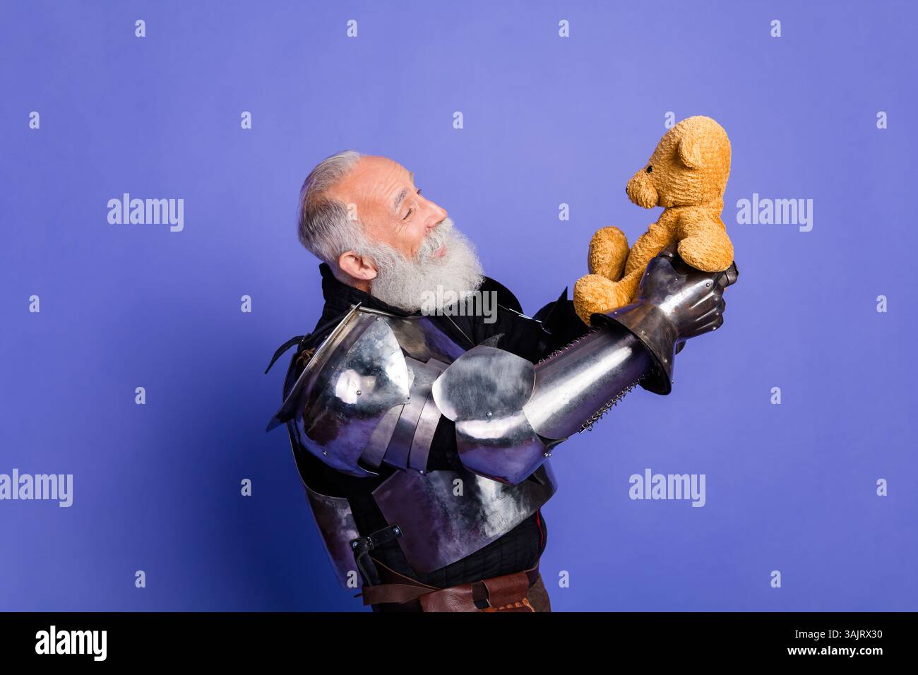 Bearded knight in shining armor holding a teddy bear against a purple ...