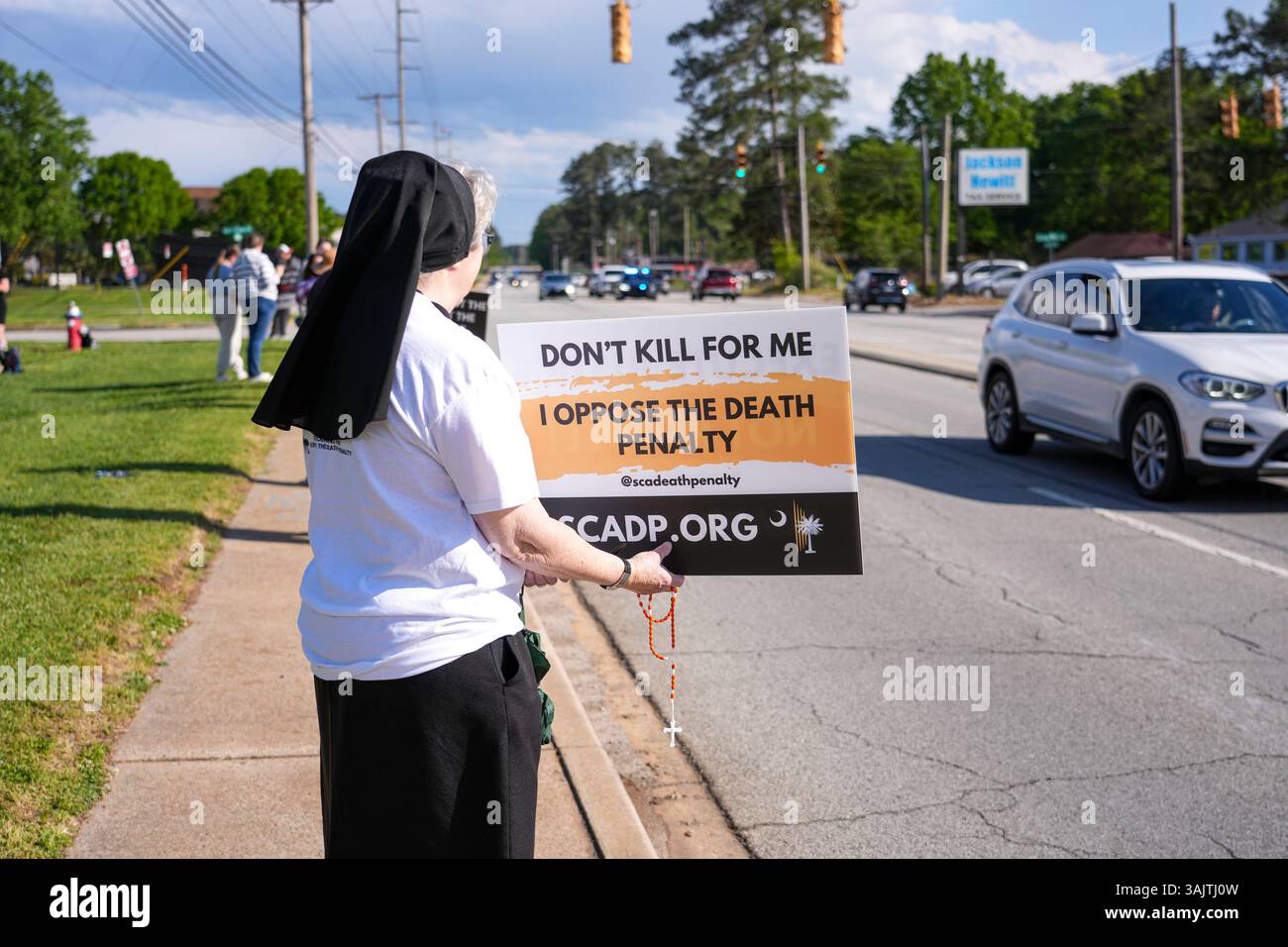 Sister Pamela Smith demonstrates outside the site of the scheduled ...