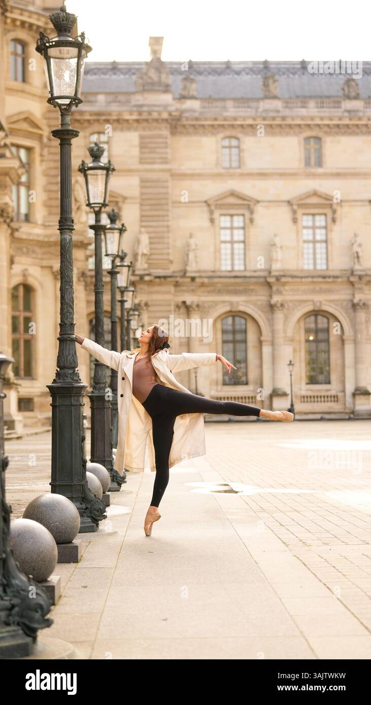 Ballet dancer posing near Louvre Museum in Paris, France Stock Photo ...