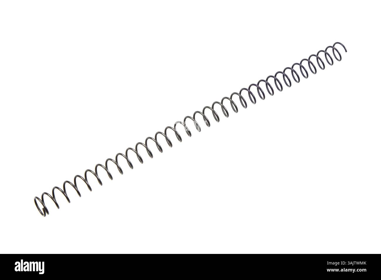 Metal coil spring isolated on white background, minimal studio lighting ...