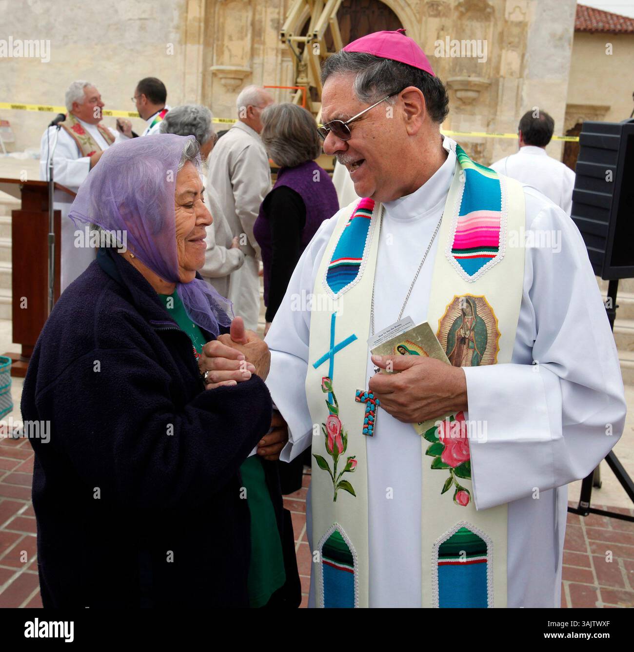 Maria Morales, 82 from Salinas, greets Bishop Richard J. Garcia at the ...