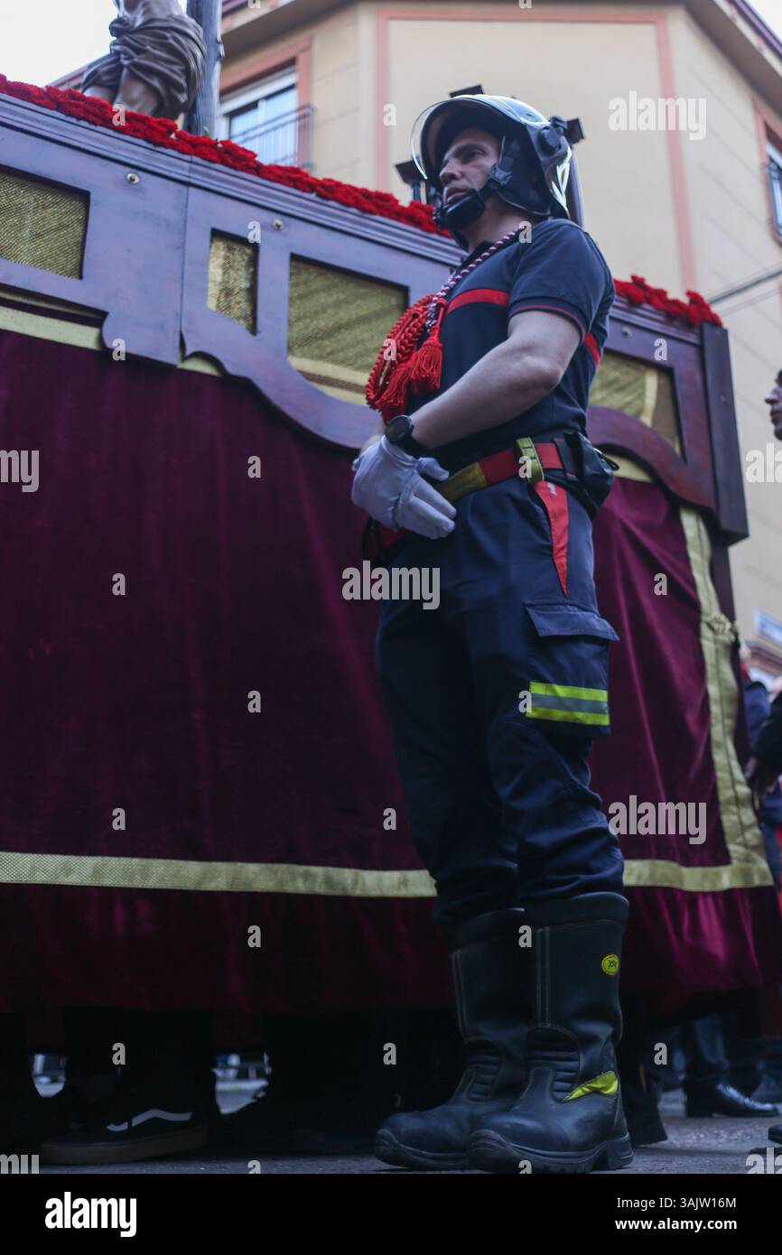 Madrid, Spain, April 11, 2025: A firefighter escorts the image of ...
