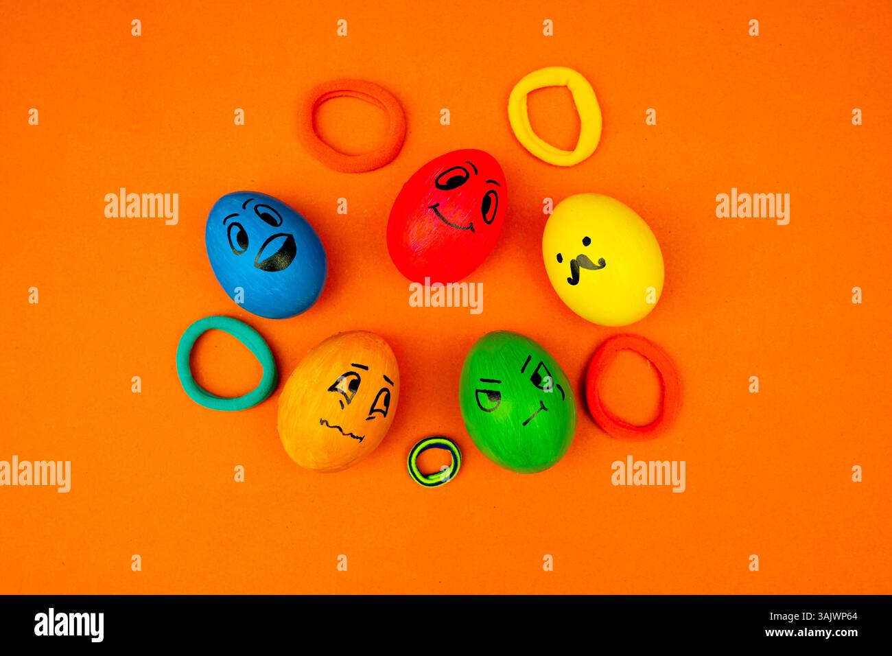 Creative Easter Egg Faces With Fun Expressions On Orange. Five painted ...