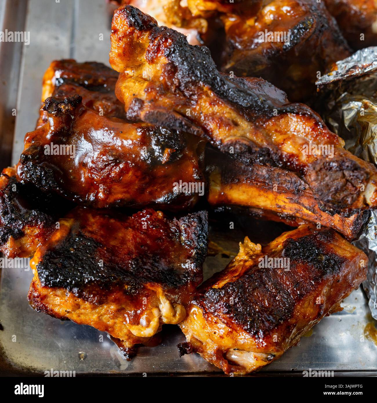 A tantalizing display of grilled ribs coated in a rich glaze ...