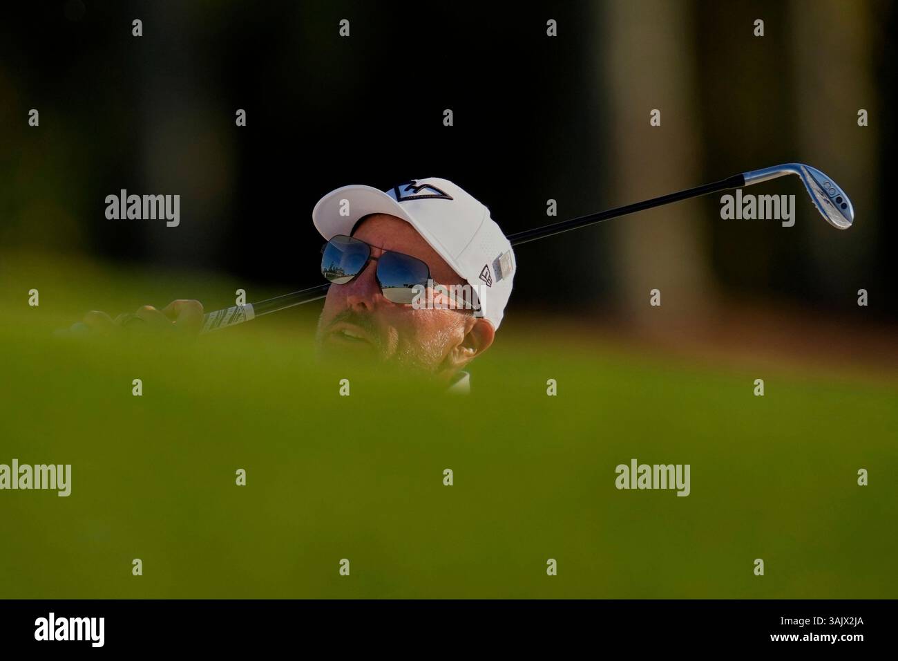 Phil Mickelson. chips to the green on the 18th hole during the second ...