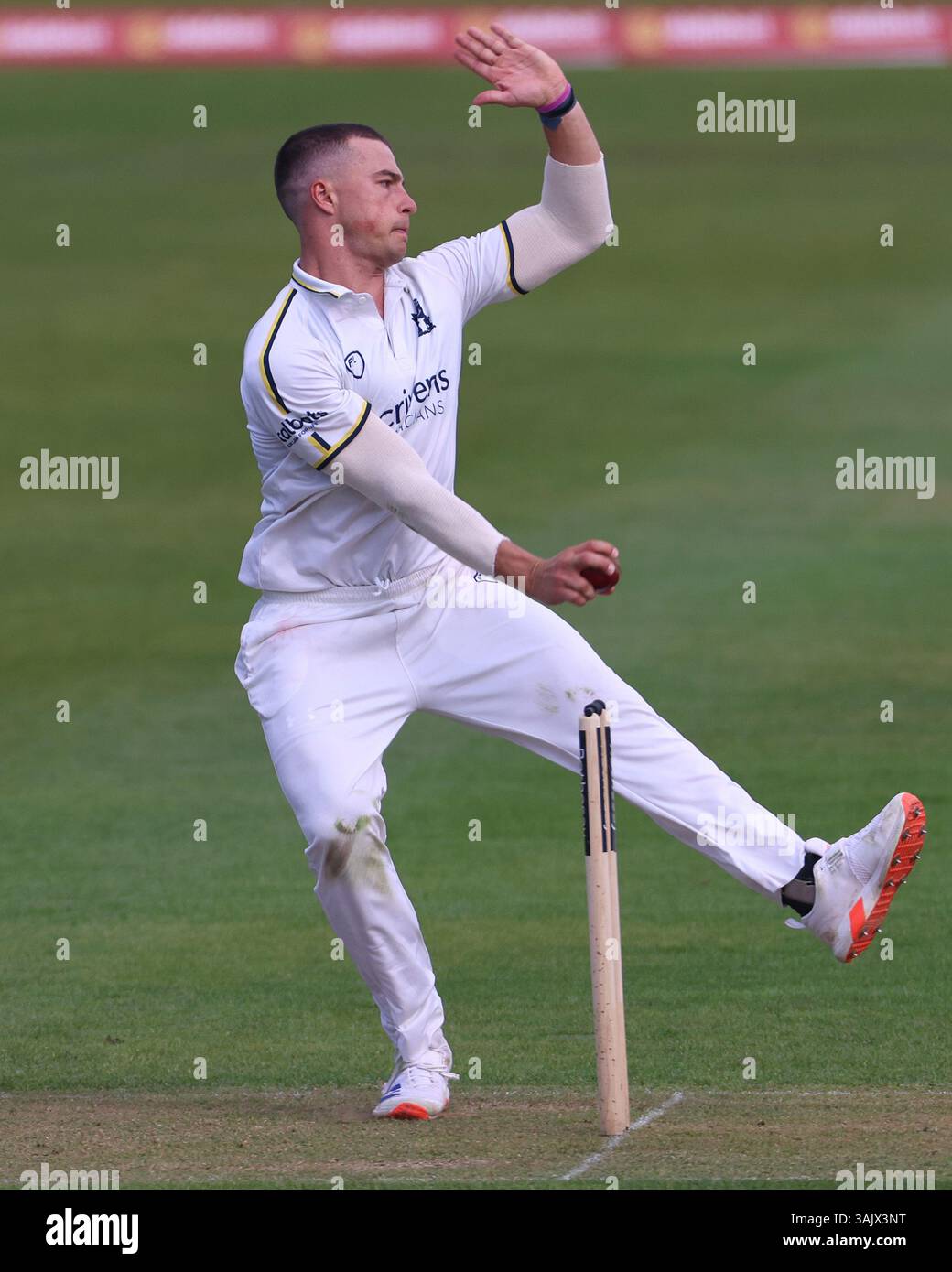 Warwickshire's Michael Booth is seen bowling during the First Day of ...