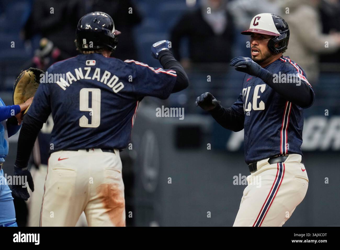 Cleveland Guardians' Gabriel Arias, right, celebrates with teammate ...