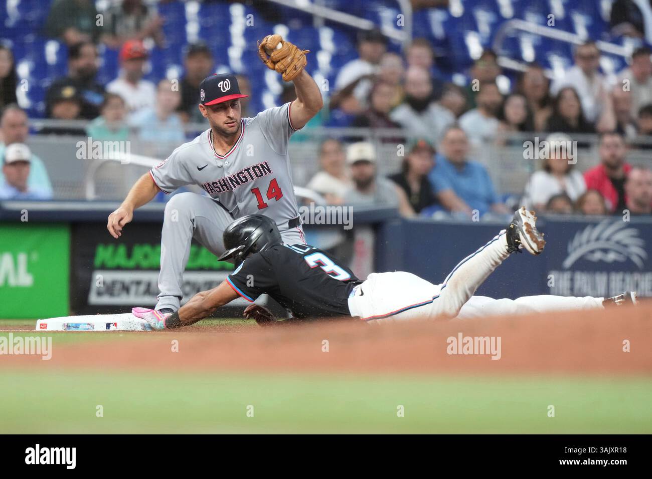 Miami Marlins' Derek Hill (3) beats the throw to Washington Nationals ...
