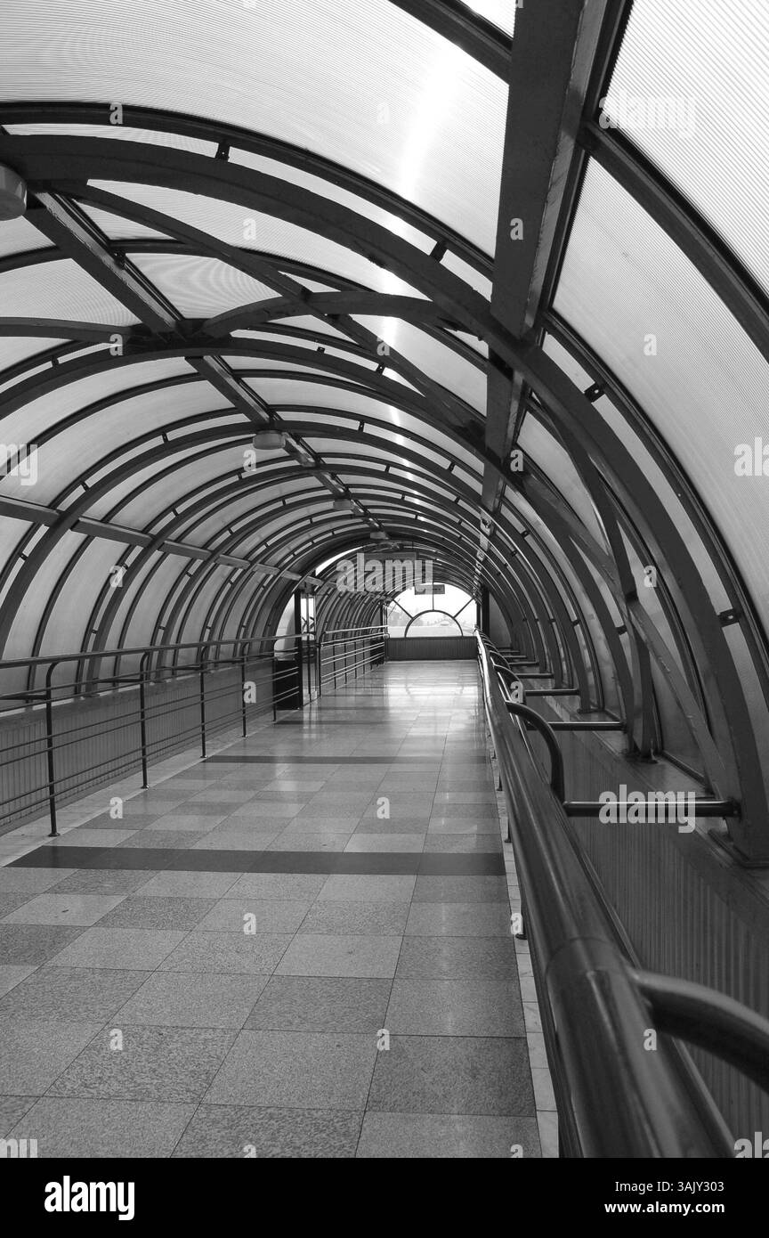 Roofed viaduct at railway station, grayscale Stock Photo - Alamy