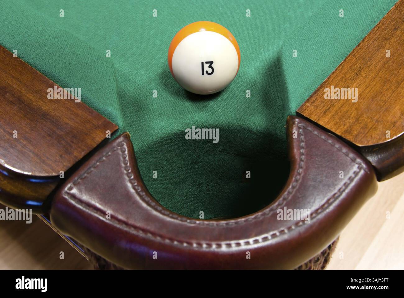 Billiard ball number thirteen by corner pocket Stock Photo - Alamy