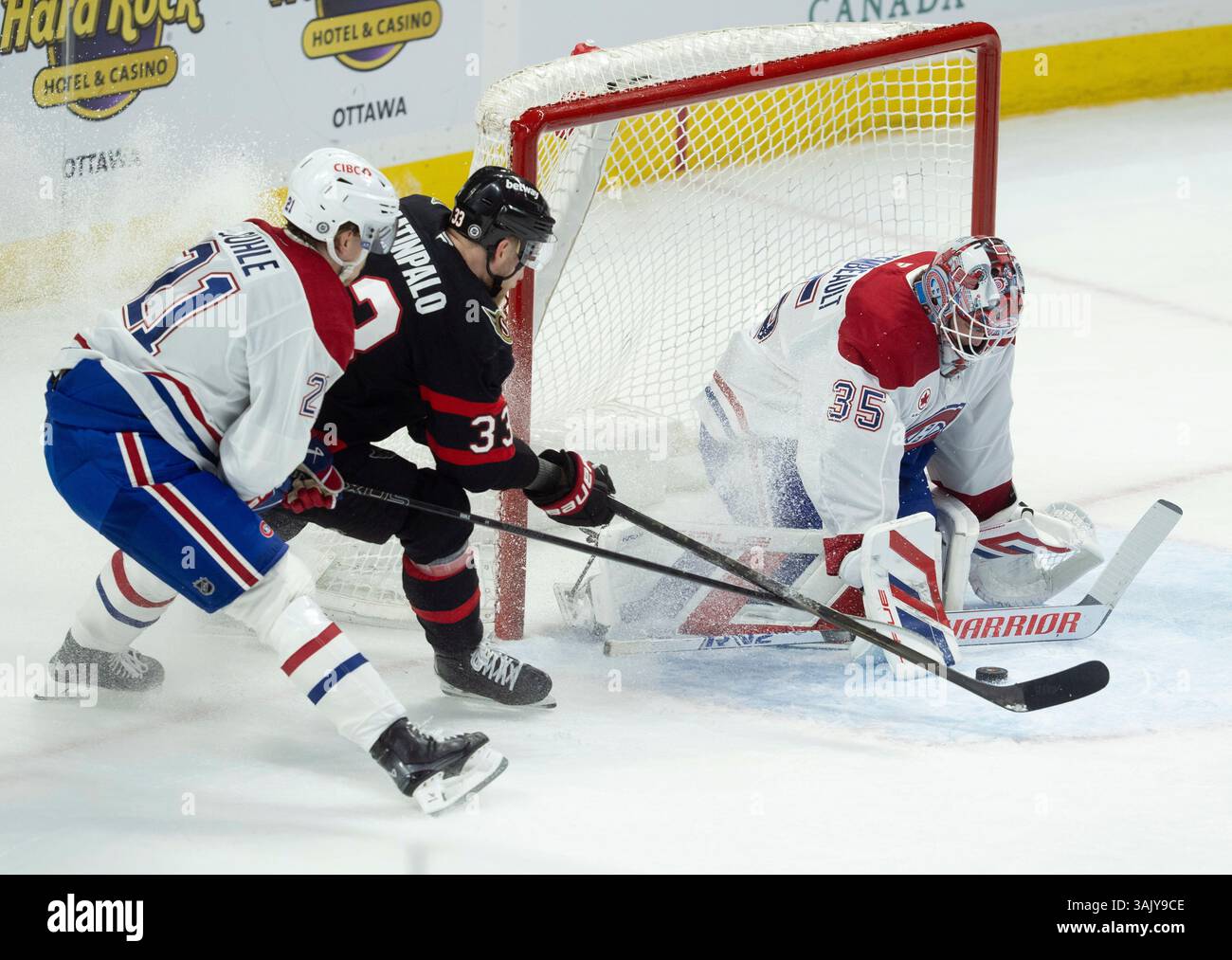 Montreal Canadiens' Kaiden Guhle (21) chases Ottawa Senators' Nikolas ...