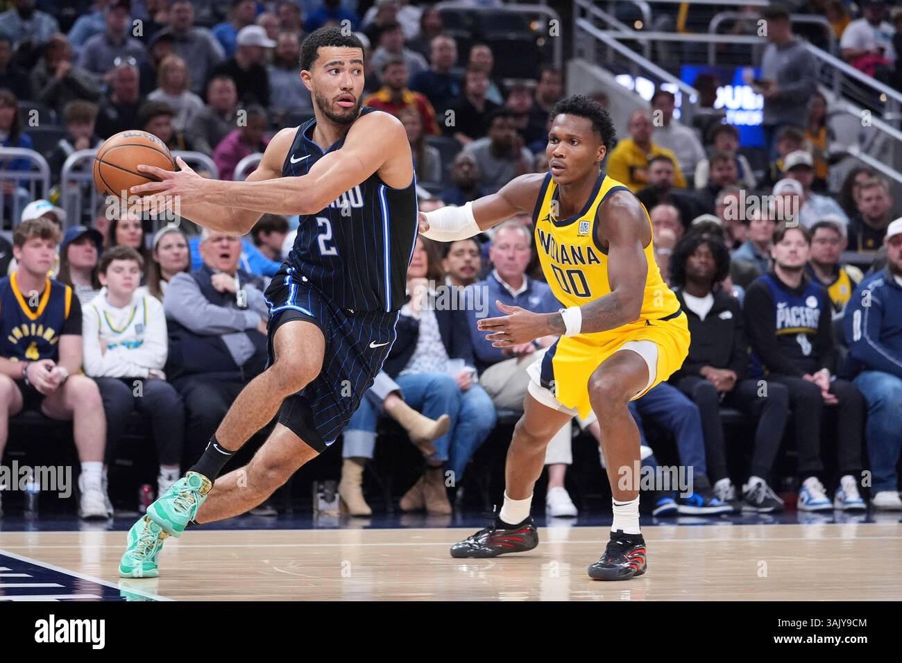 Orlando Magic guard Caleb Houstan (2) drives on Indiana Pacers guard ...