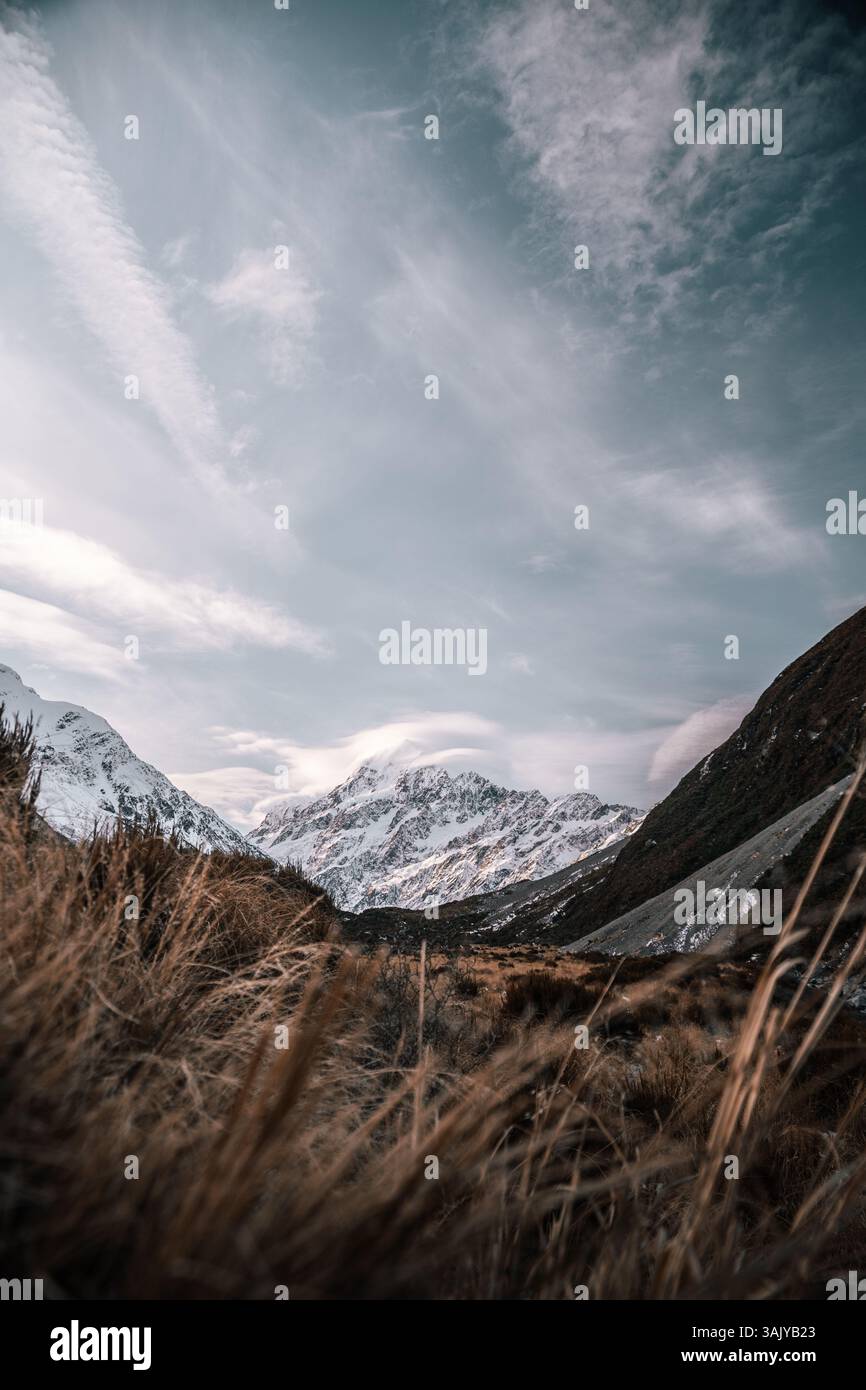 Snow-capped Mount Cook in winter with swirling clouds, Southern Alps ...
