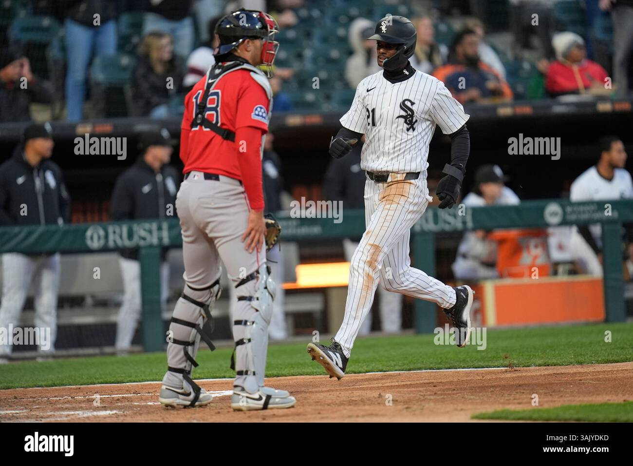 Chicago White Sox's Michael A. Taylor (21) scores on a double from ...