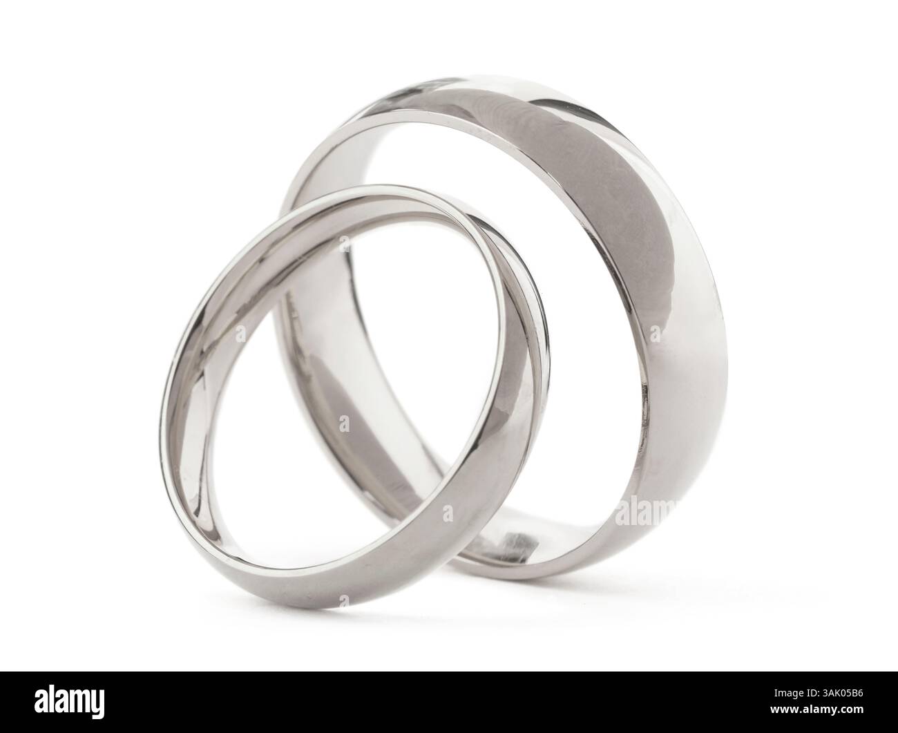 Shiny silver wedding rings isolated on white Stock Photo - Alamy