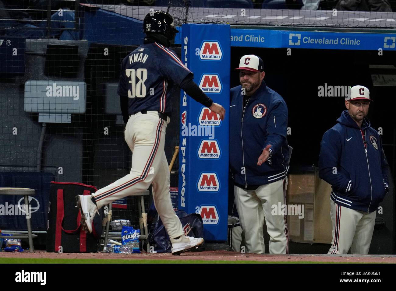 Cleveland Guardians' Steven Kwan (38) is greeted by Stephen Vogt ...