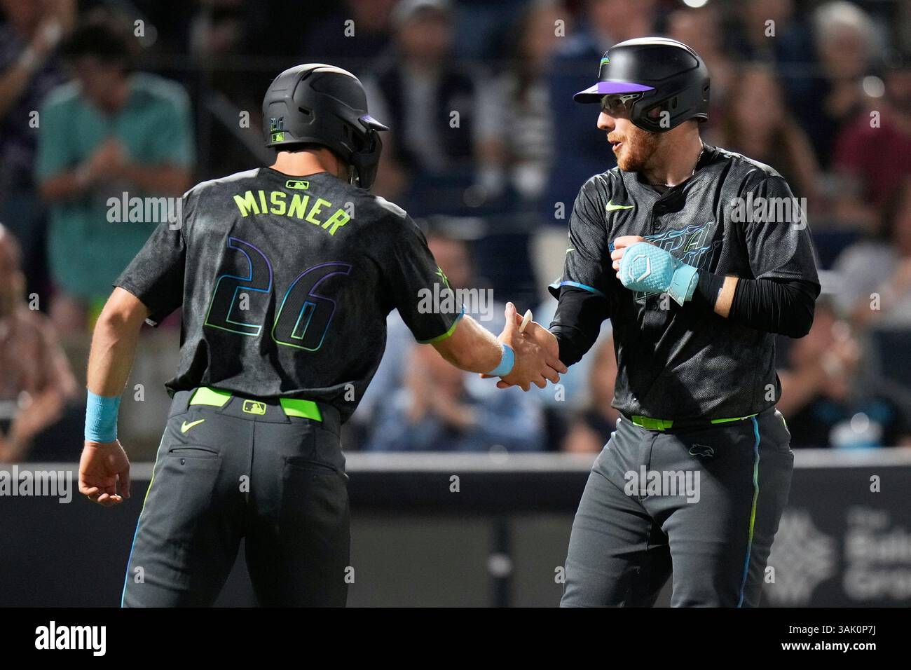 Tampa Bay Rays' Danny Jansen, right, celebrates his two-run home run ...