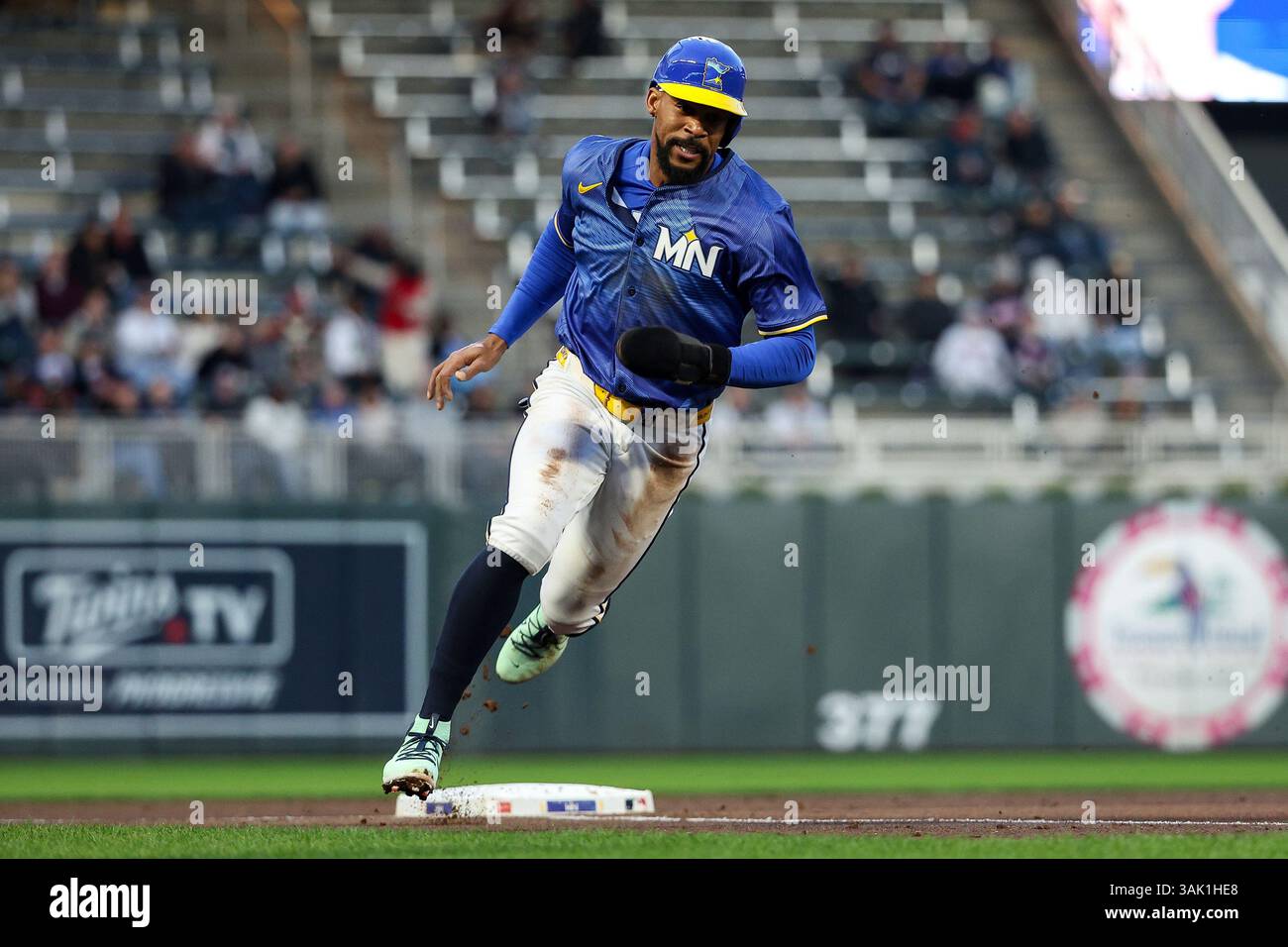 Minnesota Twins' Byron Buxton rounds third base to score on a single ...