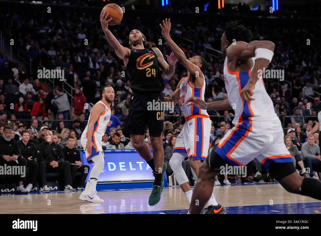 Cleveland Cavaliers' Jaylon Tyson (24), second from left, drives to the ...