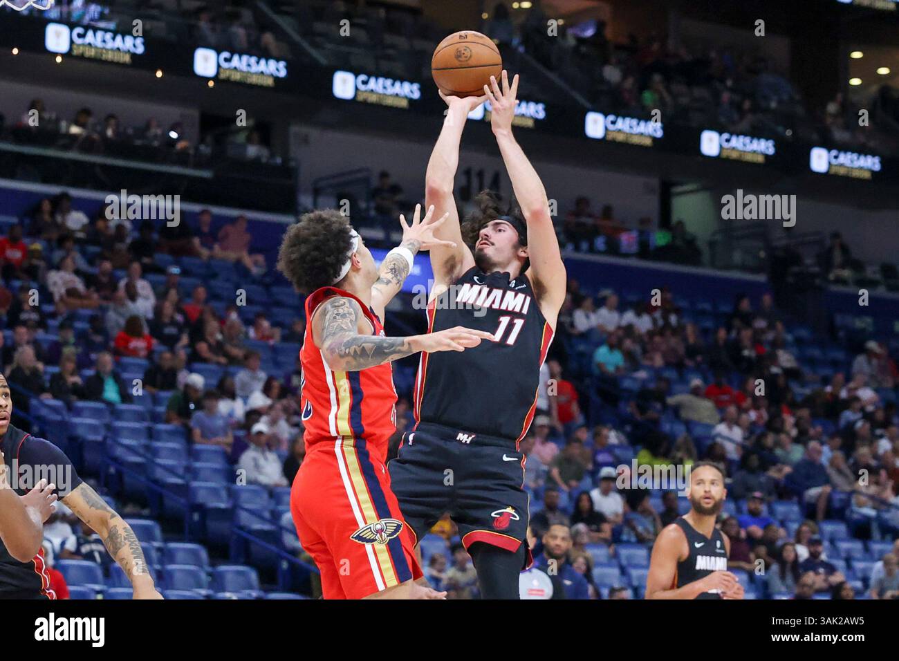 Miami Heat guard Jaime Jaquez Jr. (11) shoots a jumper over New Orleans ...