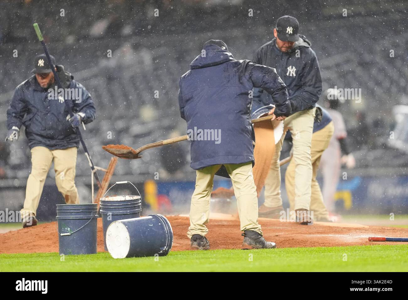 BRONX, NY - APRIL 11: The New York Yankees ground crew work to restore ...