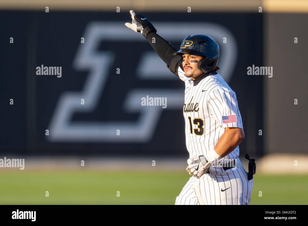 Purdue utility Sergio DeCello (13) gestures as he rounds the bases after hitting a home run ...