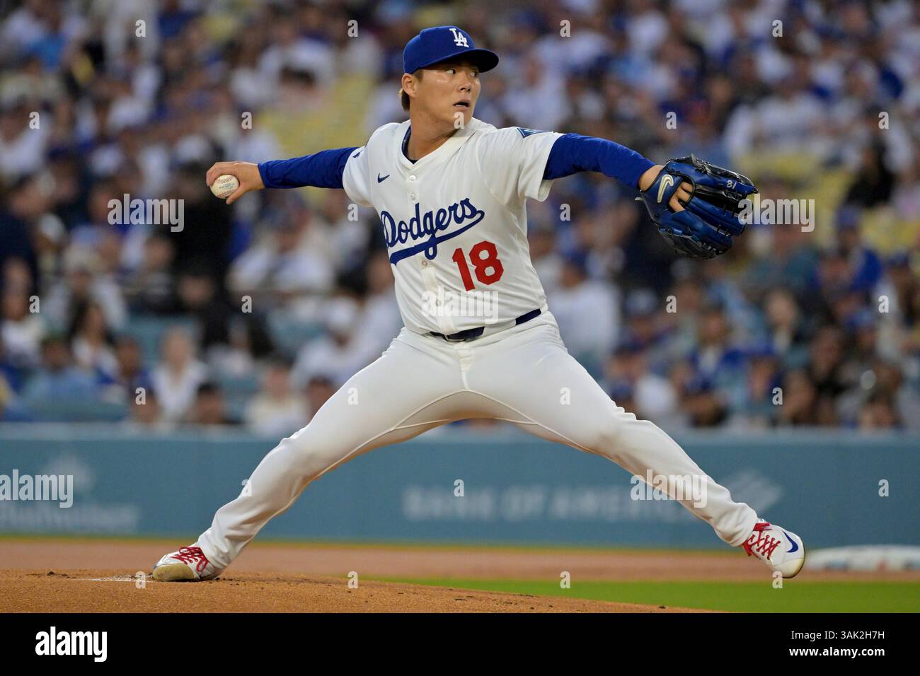 Los Angeles Dodgers starting pitcher Yoshinobu Yamamoto delivers during ...