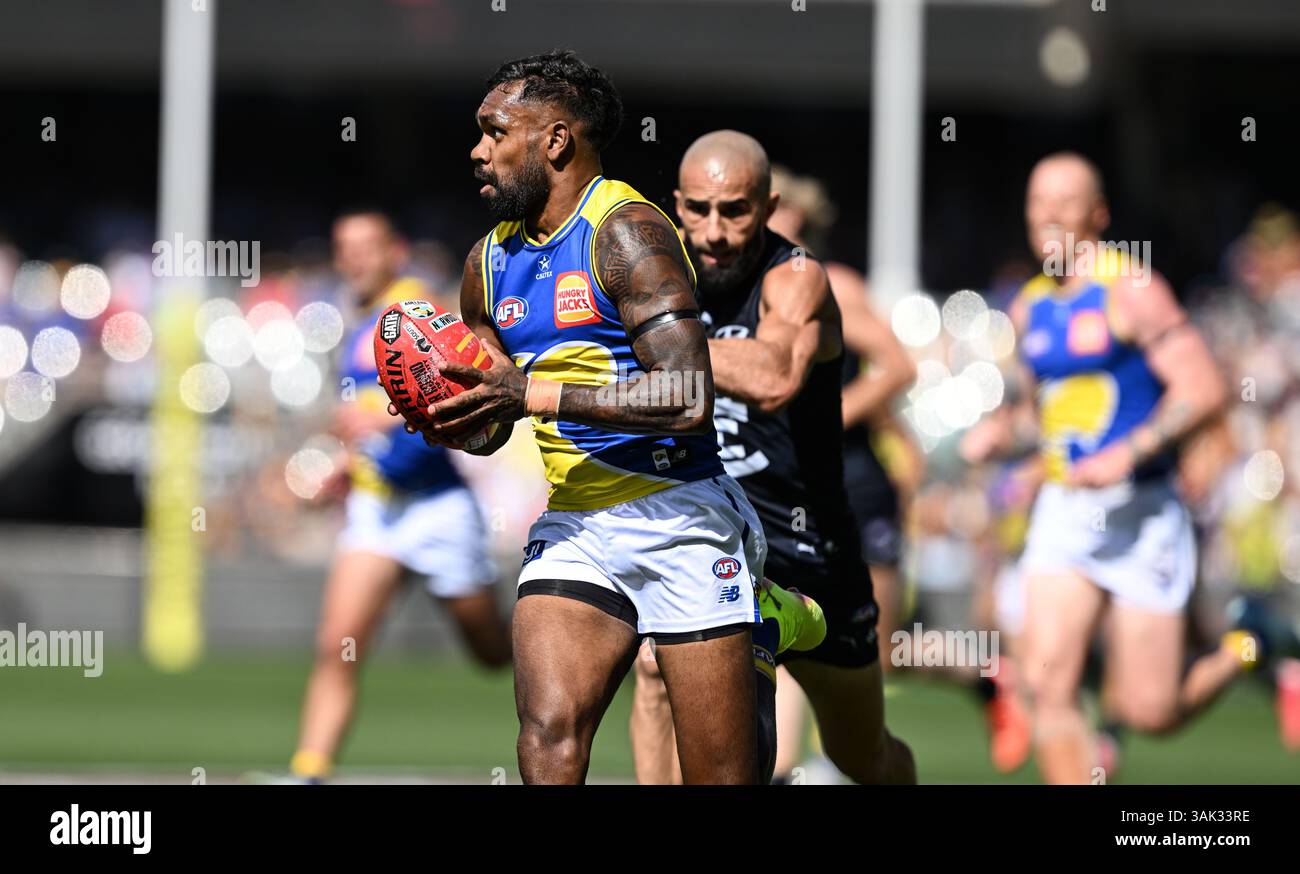 Liam Ryan of the West Coast Eagles runs away from Adam Saad of Carlton ...