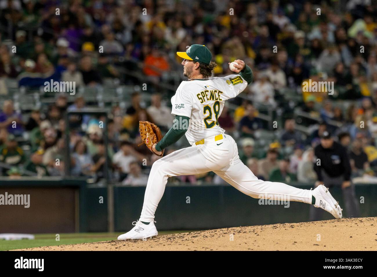 Athletics pitcher Mitch Spence throws to the New York Mets during the ...