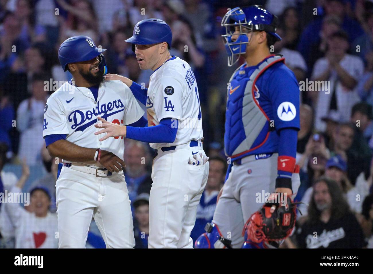Chicago Cubs catcher Miguel Amaya, right, looks on as Los Angeles Dodgers' Teoscar Hernandez (37 ...