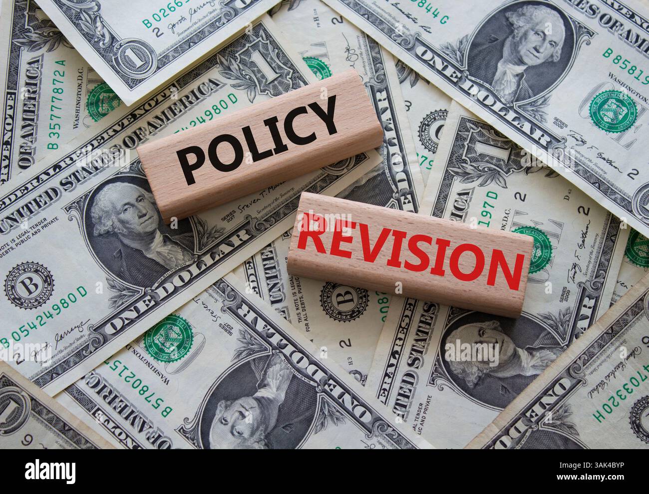 Policy revision symbol. Concept word Policy revision on wooden blocks ...