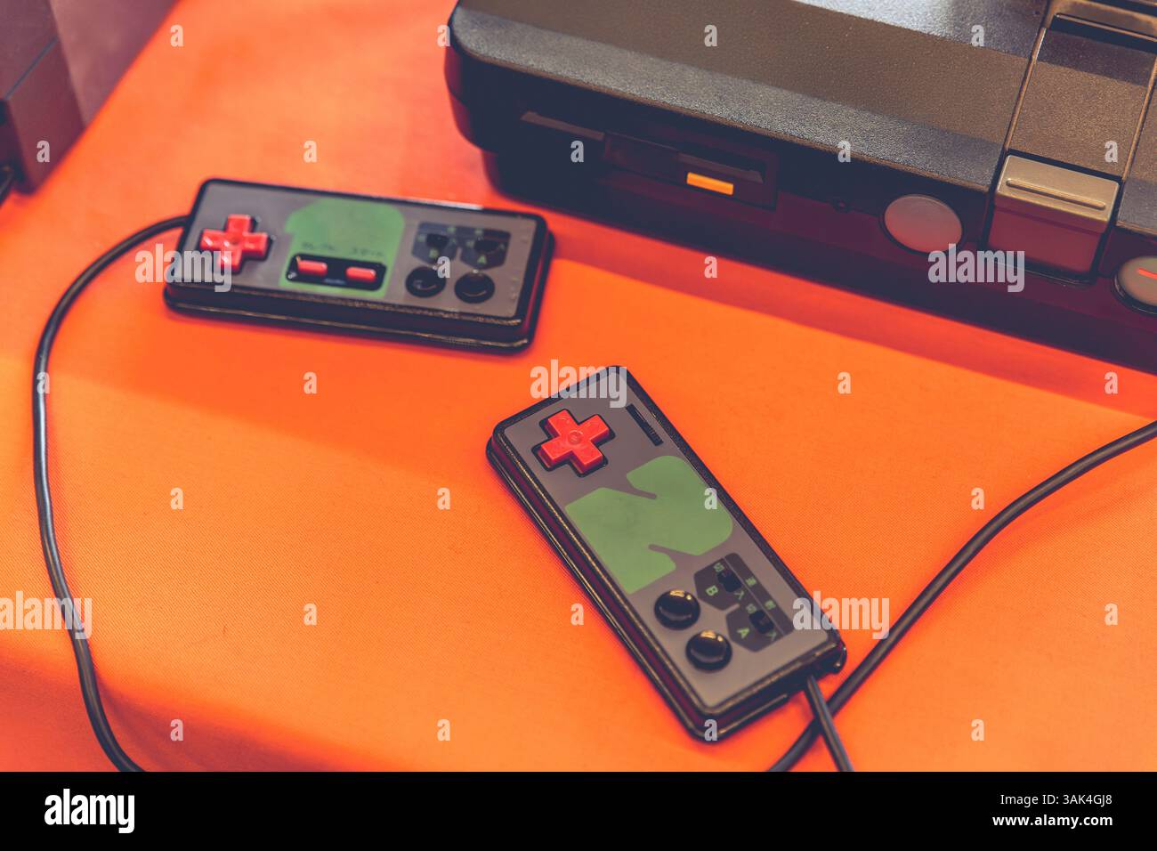 Retro 90s Video Game Console with Two Wired Controllers Stock Photo - Alamy
