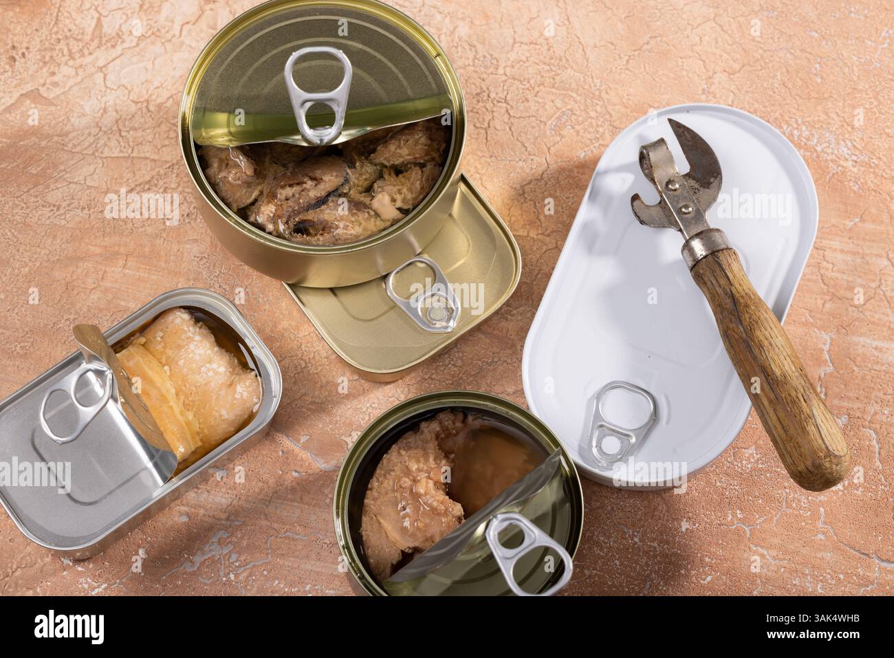 Canned tuna in different cans on a grey background with space for your ...