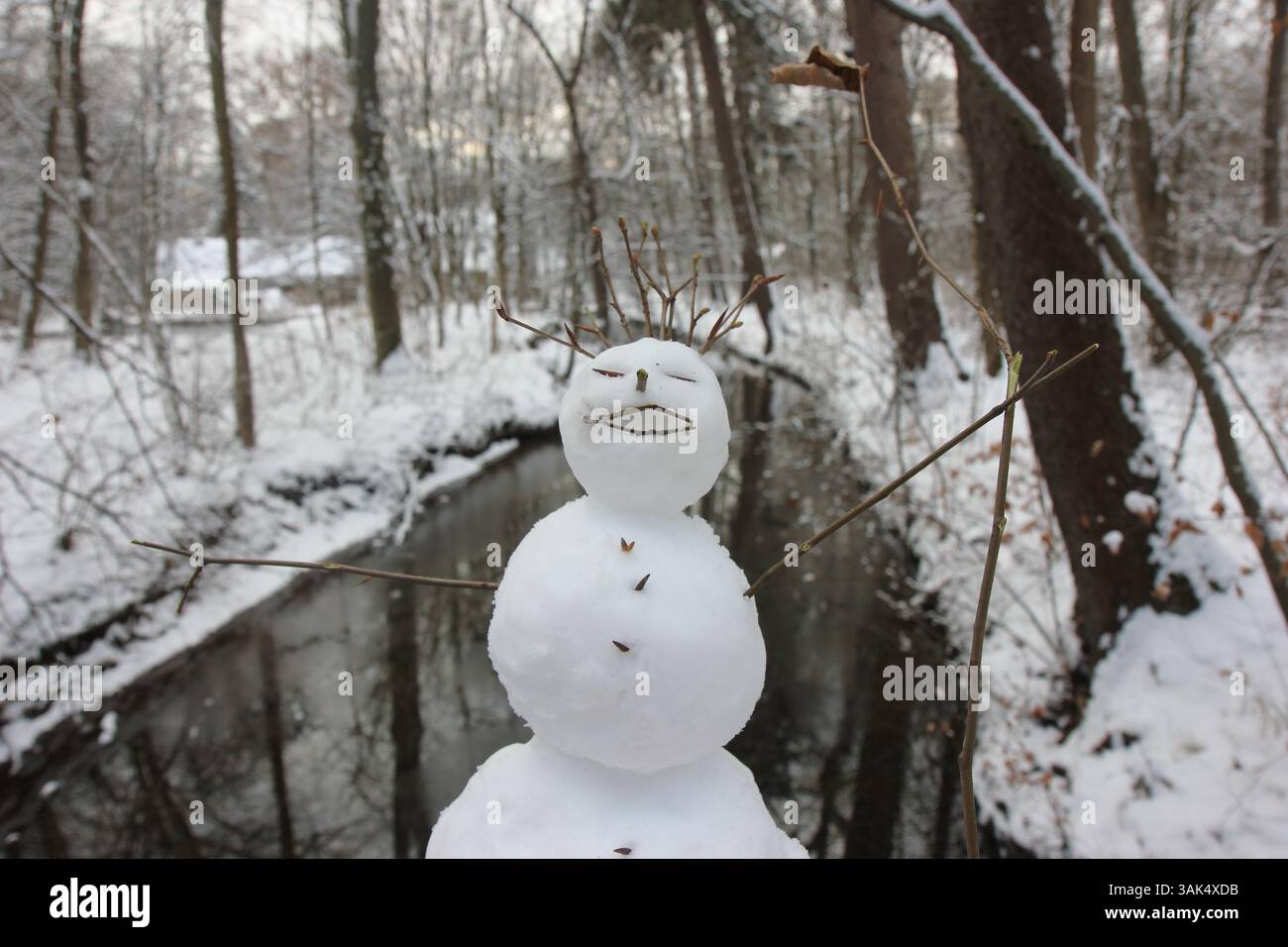 Picture series of funny tiny snow men, built on a romantic bridge ...