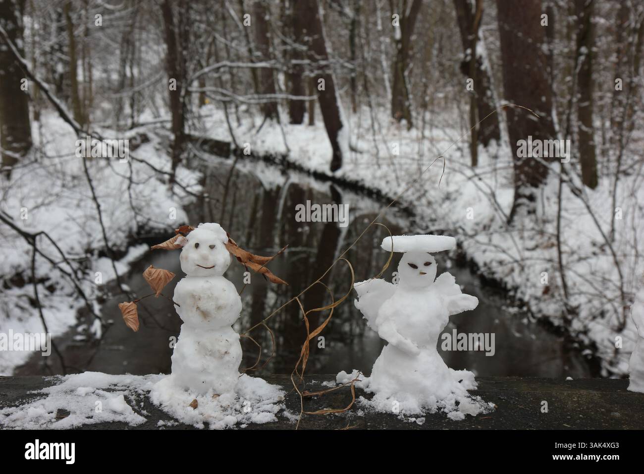 Picture series of funny tiny snow men, built on a romantic bridge ...