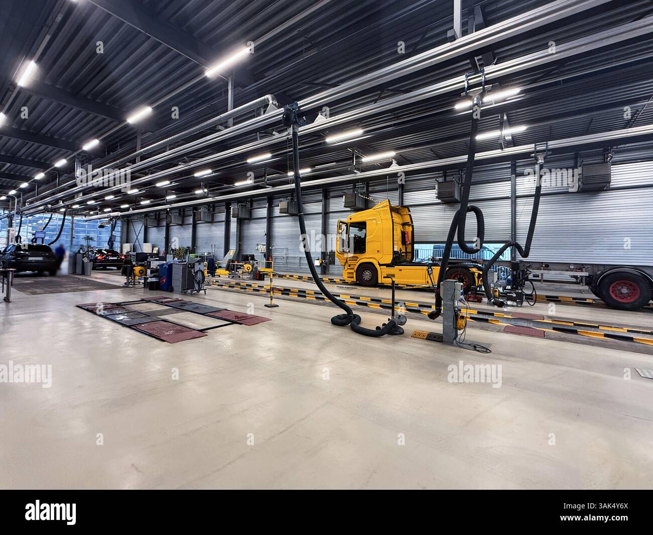 Different cars undergoing procedure of vehicle inspection at station ...