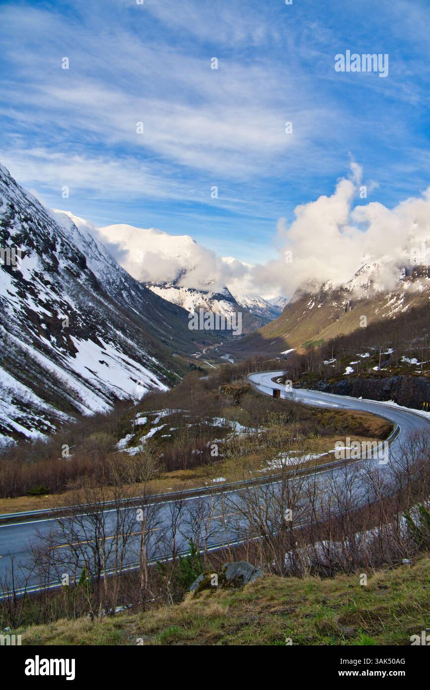 Norwegian Landscape. The Road Leads Through A Mountain Gorge That ...