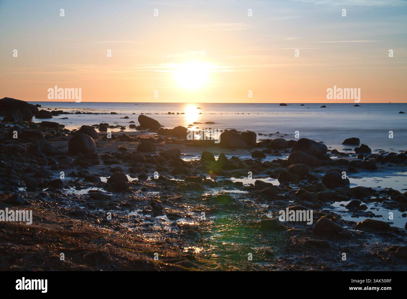 Sunset, Stone Beach With Small And Large Rocks In Front Of The ...