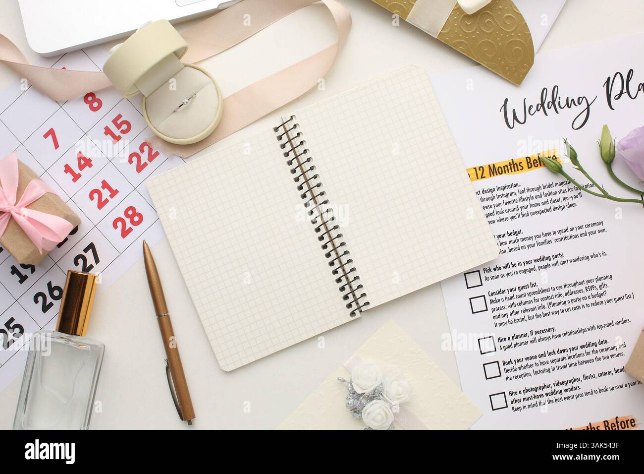 Wedding arrangement background. Female hands preparing for marriage, using laptop, smartphone ...