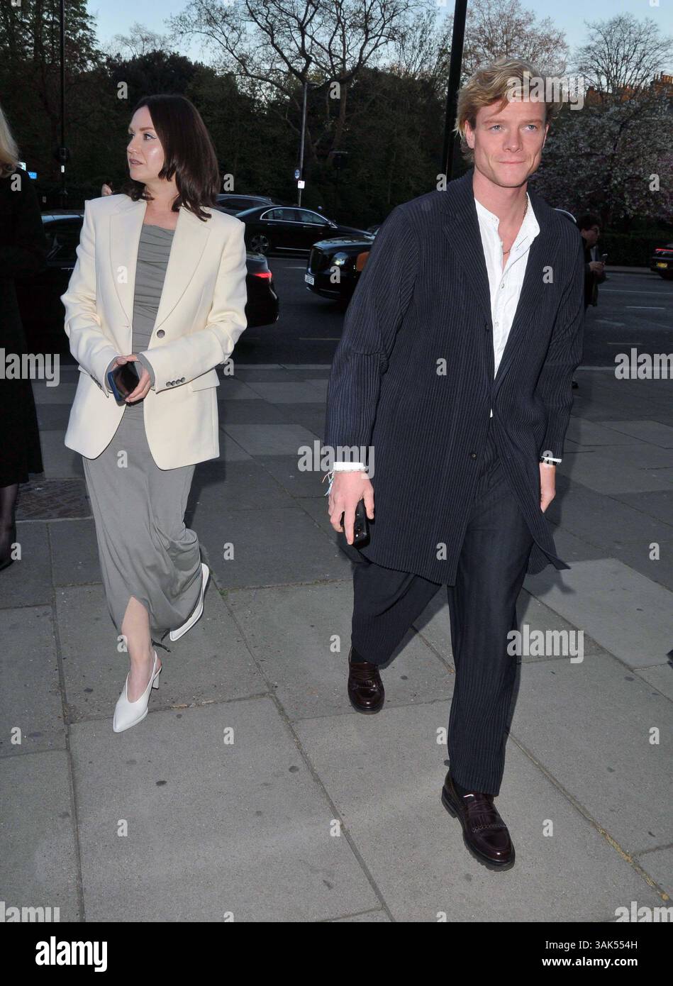 guest and Tom Rhys Harries at the Cartier Exhibition VIP private view ...