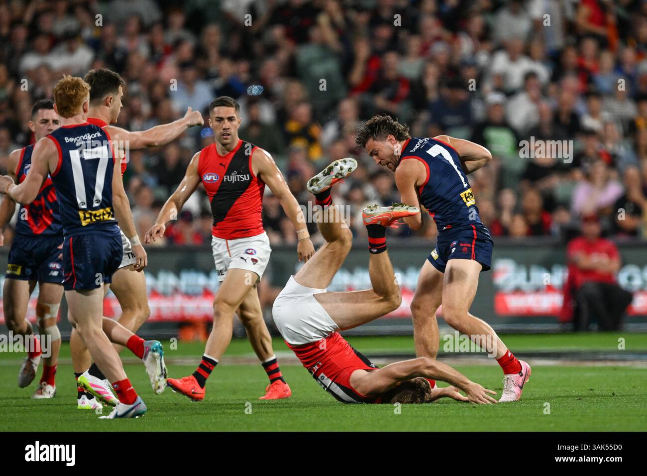 Adelaide, Australia. 12th Apr, 2025. Jack Viney of Melbourne shrugs off ...