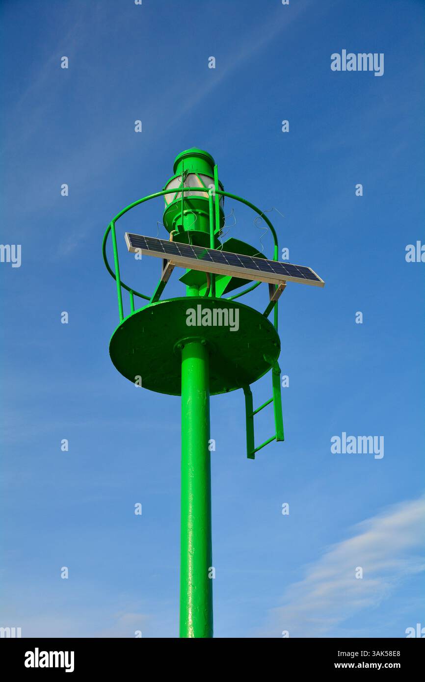 A maritime beacon at the end of the breakwater in Umag harbour in ...