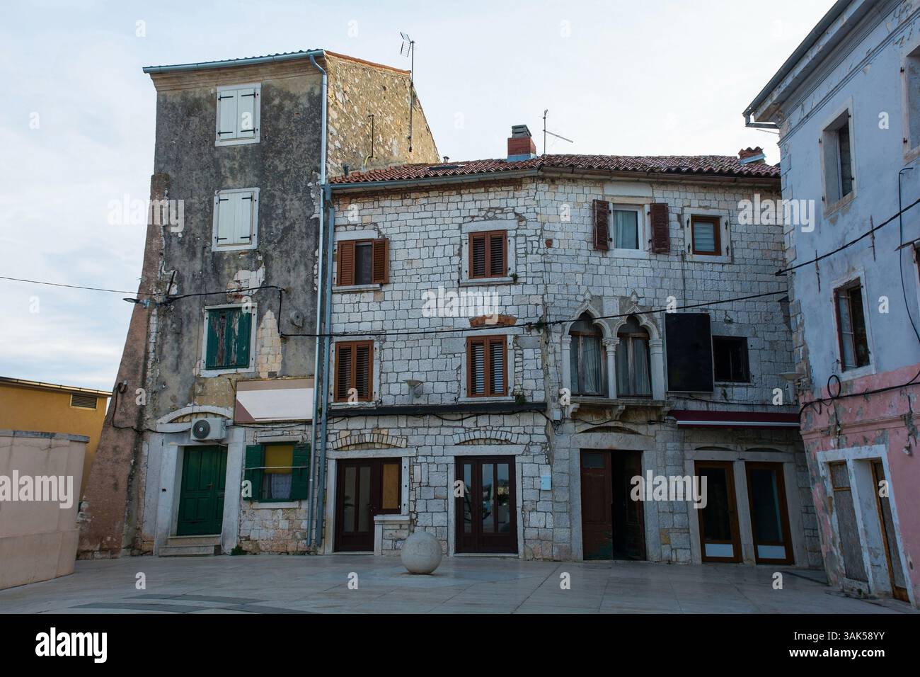 Historic buildings in a small square in Umag in Istria, north west ...