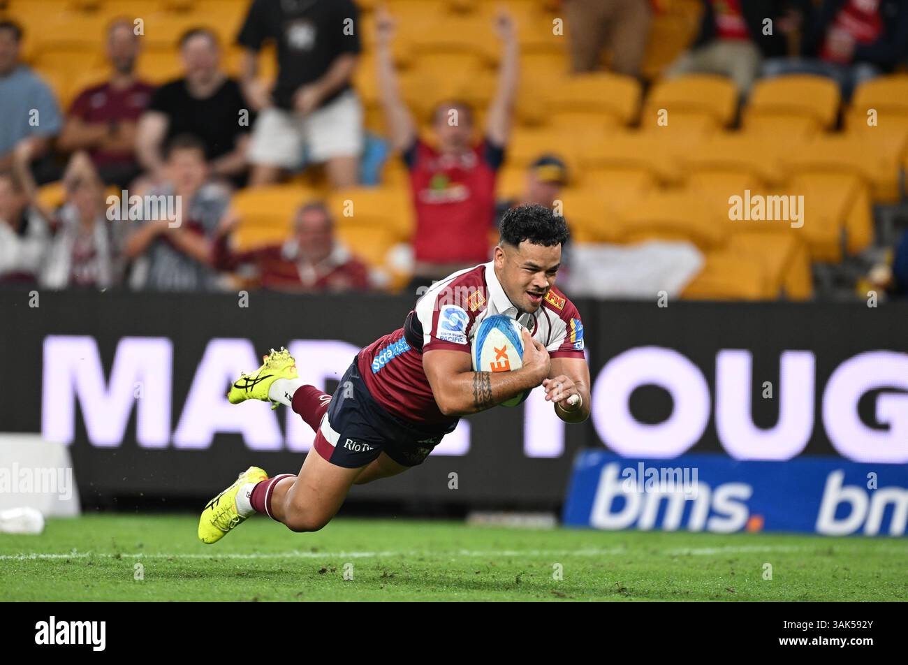Brisbane, Australia. 12th Apr, 2025. Hunter Paisami of the Reds scores ...