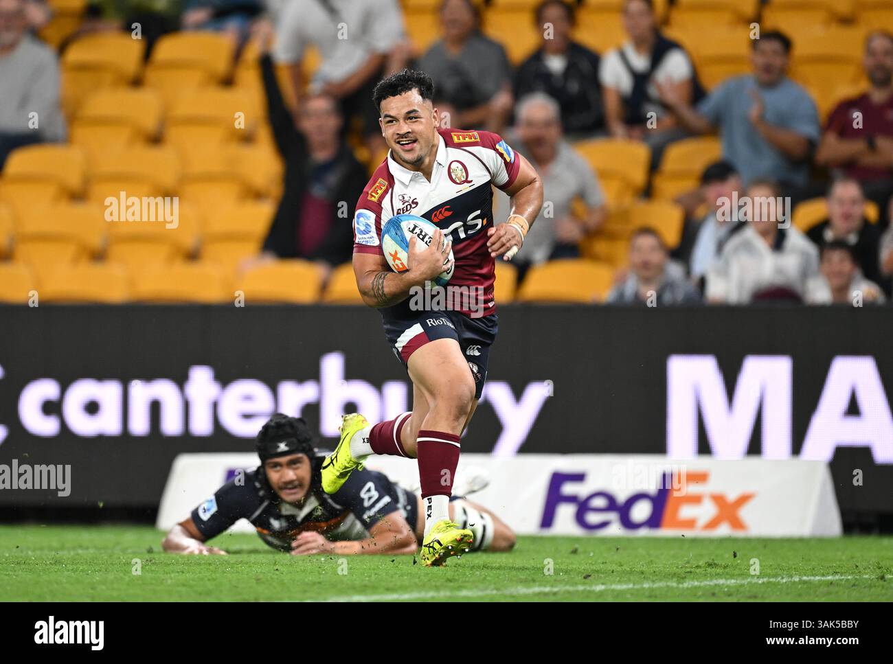 Brisbane, Australia. 12th Apr, 2025. Hunter Paisami of the Reds skips ...