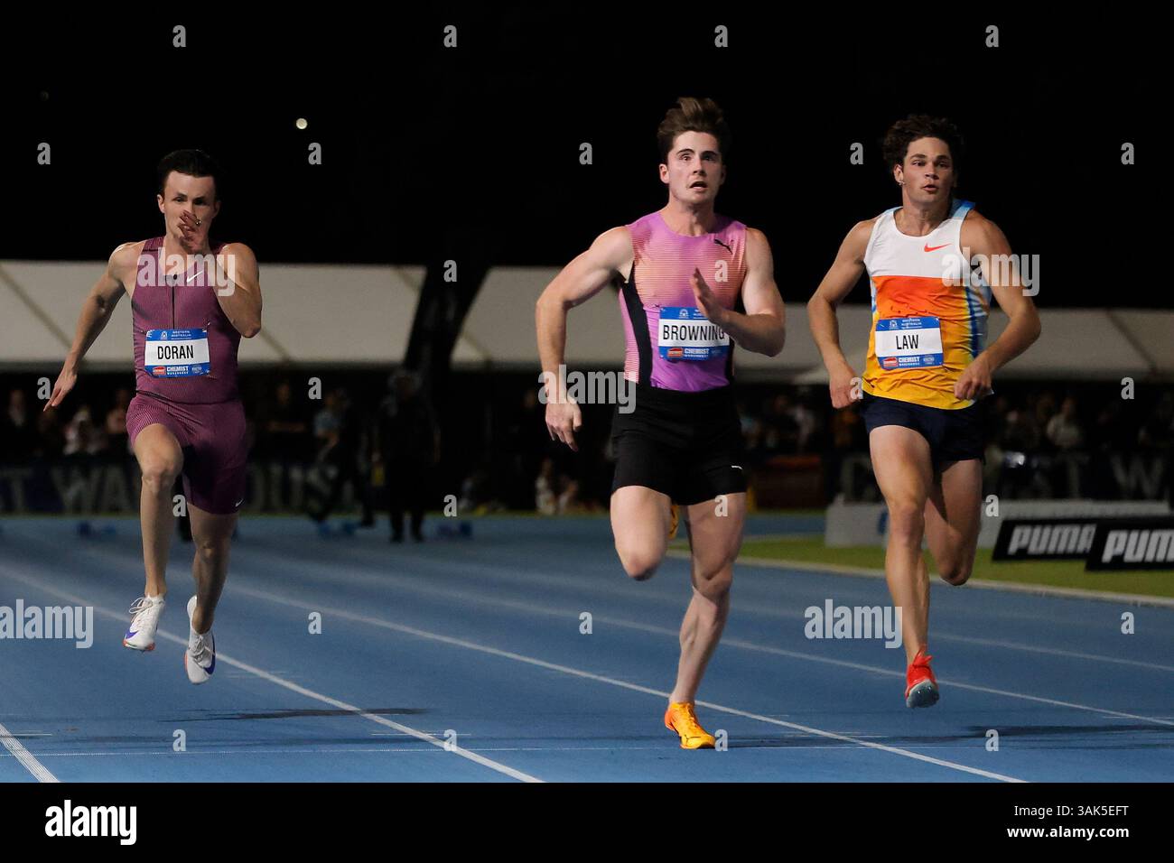Rohan Browning (centre) of New South Wales crosses the line to win the ...