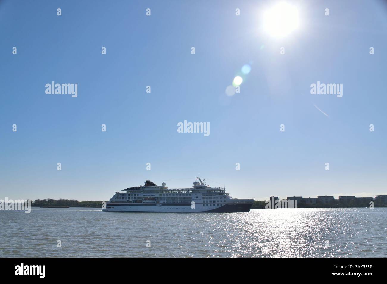 Cruise Ship HANSEATIC spirit heads up the River Thames in the morning ...