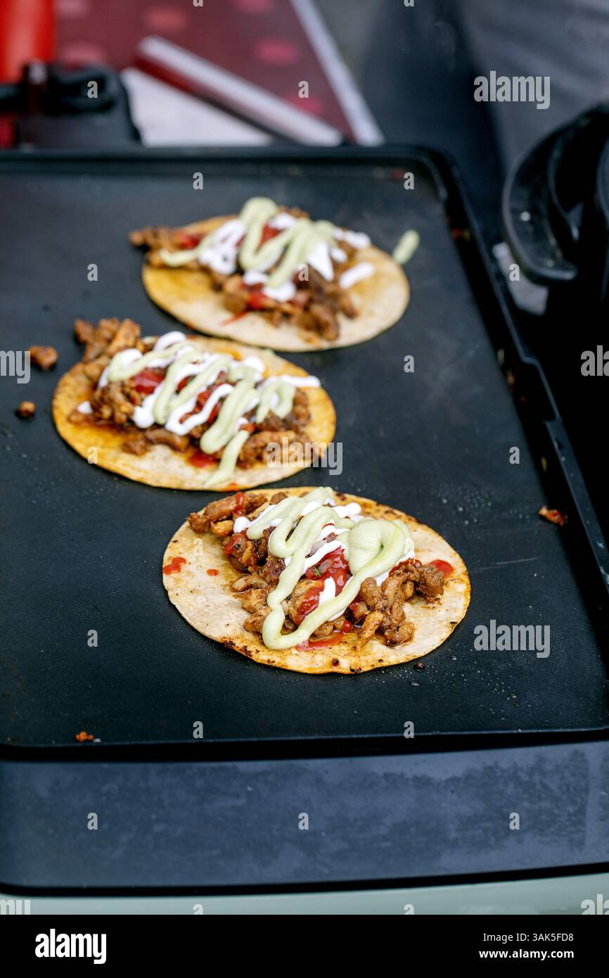 Homemade Mexican street tacos with meat tomatoes white cream and ...